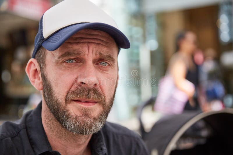 Hipster with Beard and Baseball Cap Sitting in a Street Cafe Stock ...