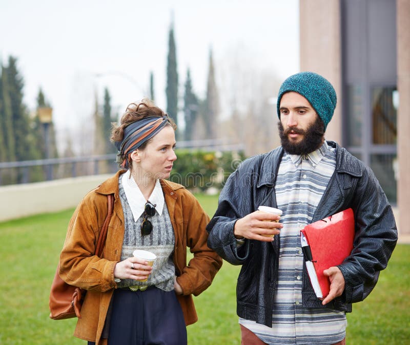 Hipster Couple Talking and Drinking Coffee To Go Stock Image - Image of ...