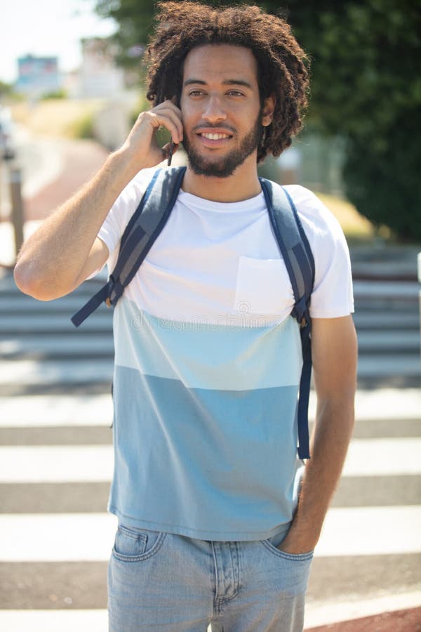 Hipster Crossing Road with Smartphone To Ear Stock Image - Image of ...