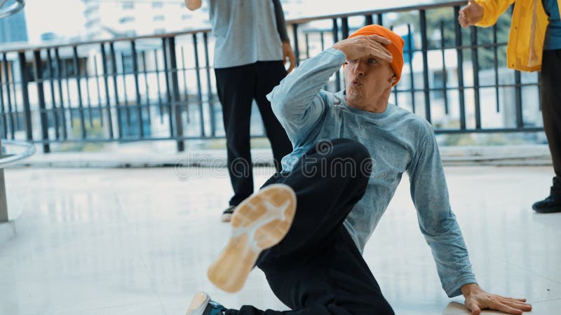 Hipster Doing Head Spin while Surrounded by Multicultural Friends ...