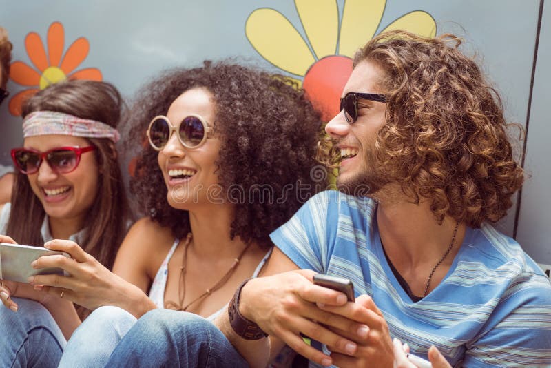 Hipster Friends Using Their Phones Stock Photo - Image of friendship ...