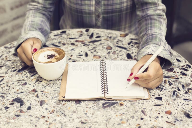 Hipster Girl Making Notes in a Diary and Drinking Coffee Stock Image ...