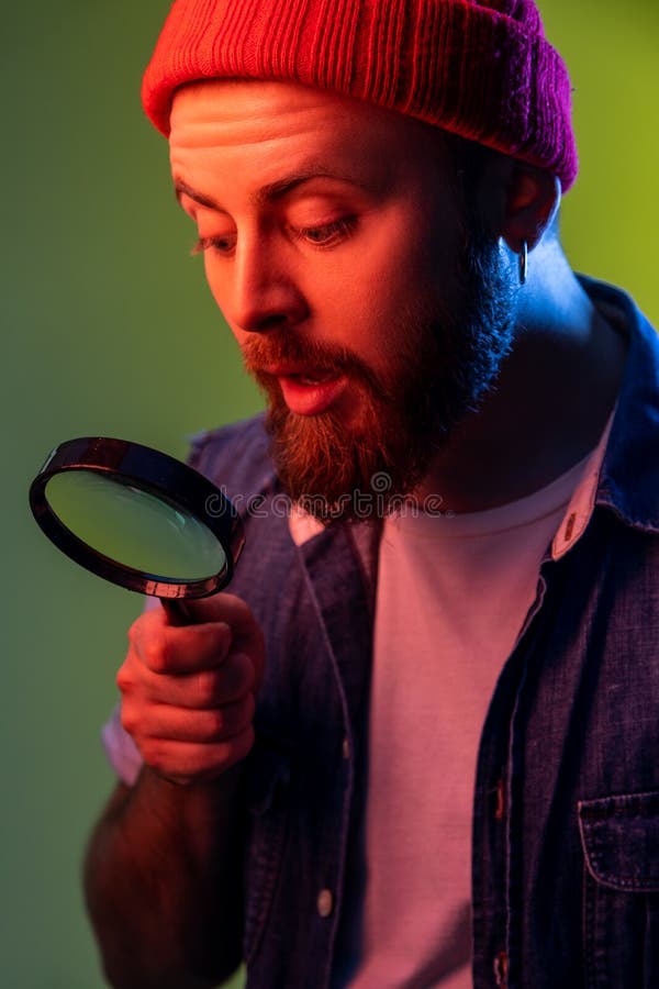 Hipster Guy Looking through Magnifying Glass, Spying, Finding Out ...