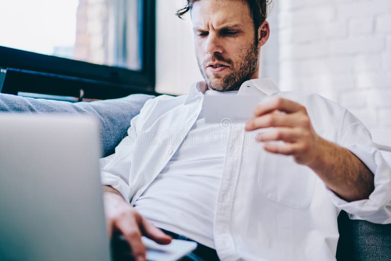 Hipster Guy Sending Text Message To Colleague while Sitting with Modern ...