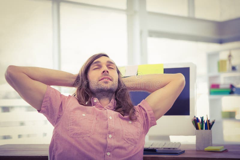 Hipster with Hands Behind Head Resting at Computer Desk Stock Image ...