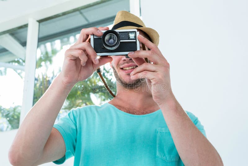 Hipster man taking picture stock image. Image of camera - 66971673