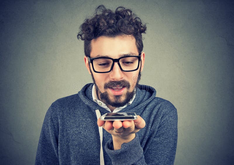 Hipster Man Using a Smart Phone Voice Recognition Function Stock Image ...