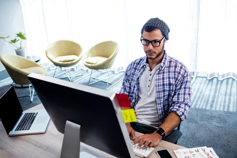 An Hipster Man Working at Computer Desk Stock Photo - Image of computer ...