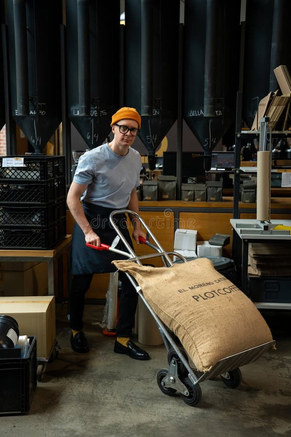 Roasting Factory Man Worker Operating Process of Creating Coffee. Stock ...