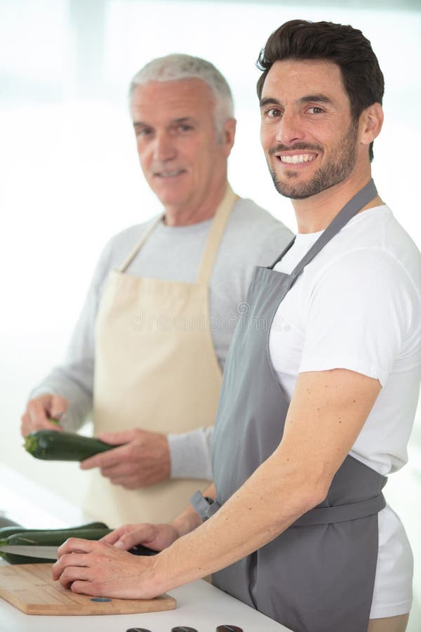 Father and son cooking stock image. Image of cooking - 12771751