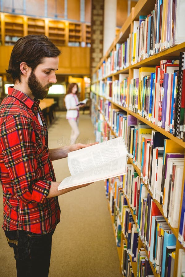 Student Picking a Book from Shelf in Library Stock Photo - Image of ...
