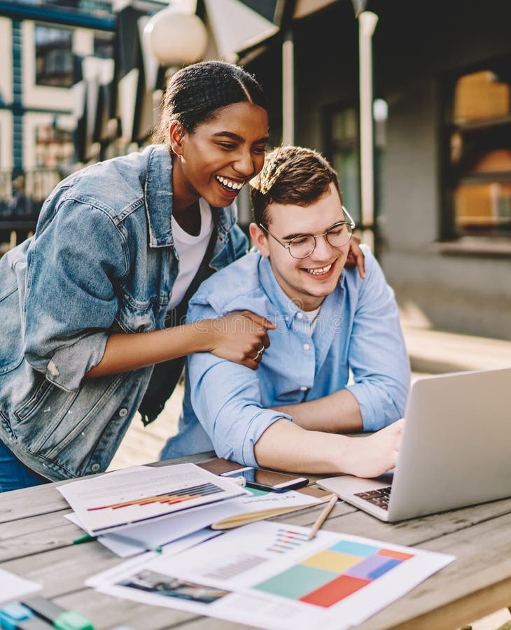 Hipsters Couple in Love Having Fun Looking at Common Photos on Laptop ...