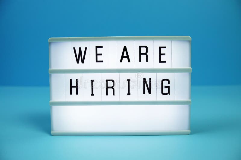 We are Hiring Letterboard Text on LED Lightbox on Blue Background Stock ...
