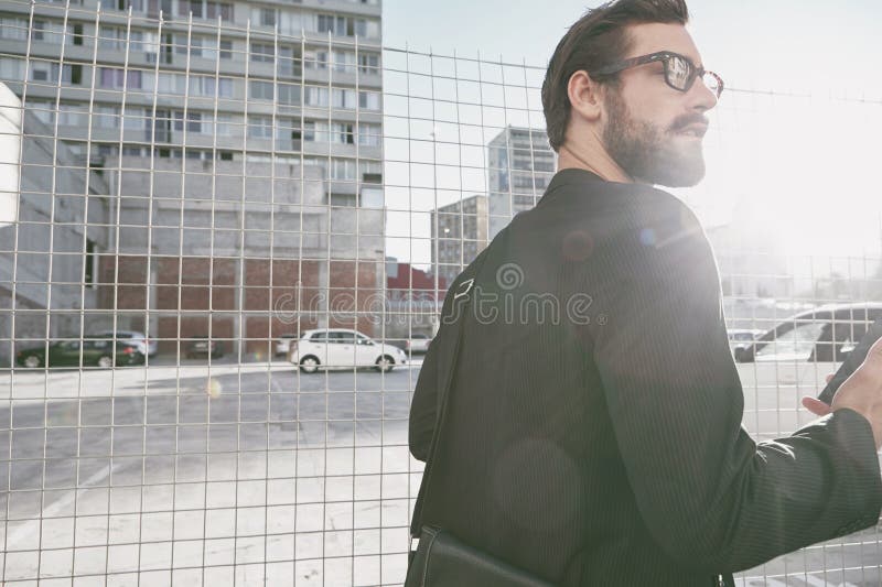 On His daily Commute. a Stylish Young Man Using His Cellphone while Out ...