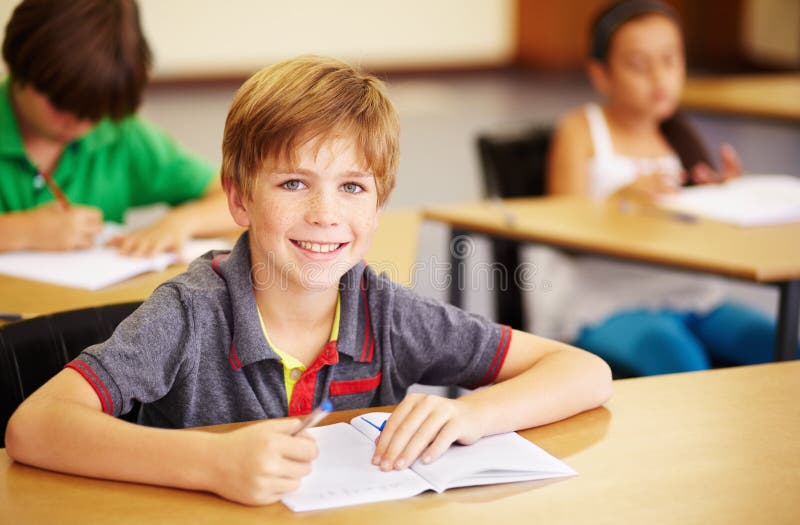 His Favorite Subject. a Cute Little Boy Doing His Homework in Class ...
