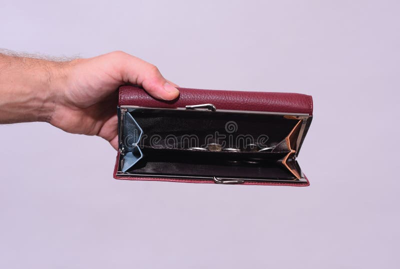There Were only Coins Left in the Empty Wallet. in the Hand on a White ...