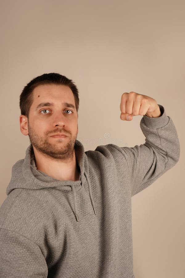 His Pose Reflects Both Physical Strength and Confidence. the Smile ...