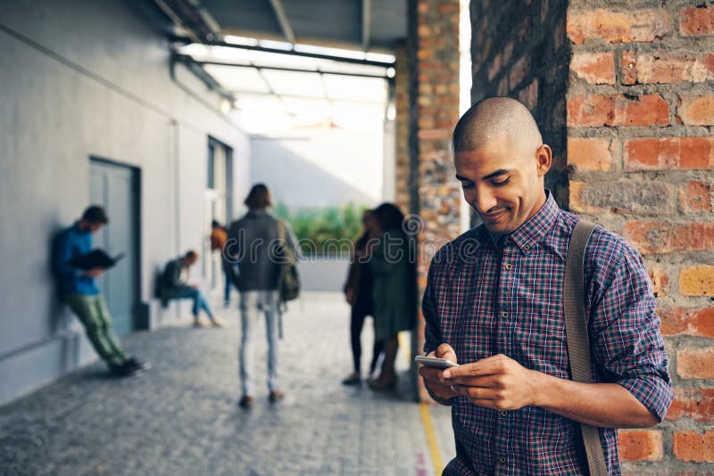 His Semesters Roster is Digitized. a Young Man Using a Mobile Phone ...