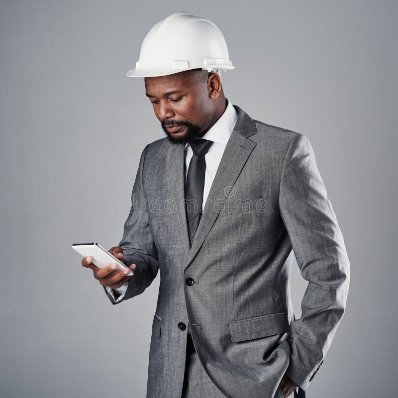 His Team Can always Reach Him. a Well-dressed Civil Engineer Using His ...
