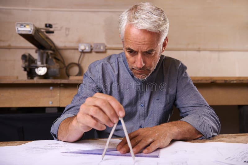 His Work is always Very Accurate. a Draftsman Using a Triangle and ...