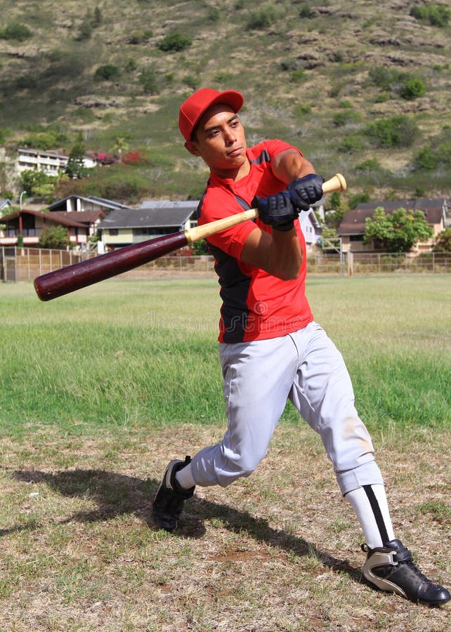 Hispanic Baseball Player Mid-swing Stock Photo - Image of mexican ...
