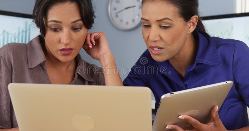 Close Up of Smiling Hispanic Business Woman in Office Looking at Camera ... Close Up of Smiling Hispanic Business Woman in Office Looking at Camera ...
