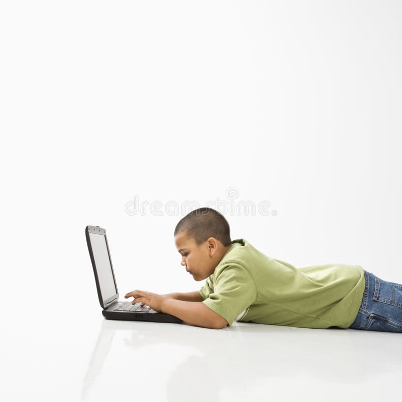 Hispanic boy on laptop. stock image. Image of online, technology - 5538693