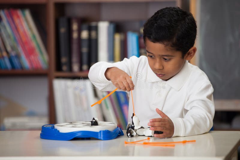 Hispanic Boy Playing Go Fish Stock Image - Image of school, elementary ...