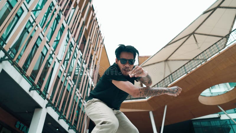 Hispanic Break Dancer Dance at Camera with Low Angle Camera. Mall ...