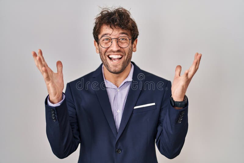 Hispanic Business Man Wearing Glasses Celebrating Crazy And Amazed For
