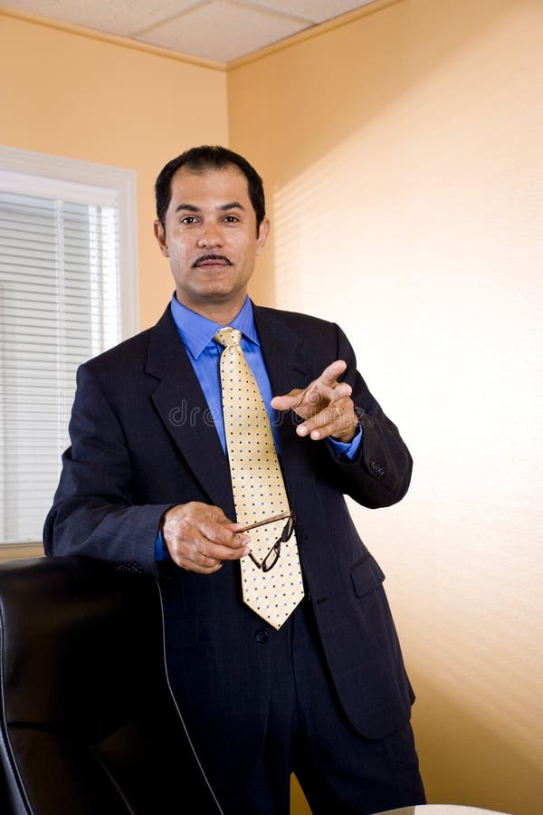 Hispanic Businessman Making a Point Stock Photo - Image of person ...
