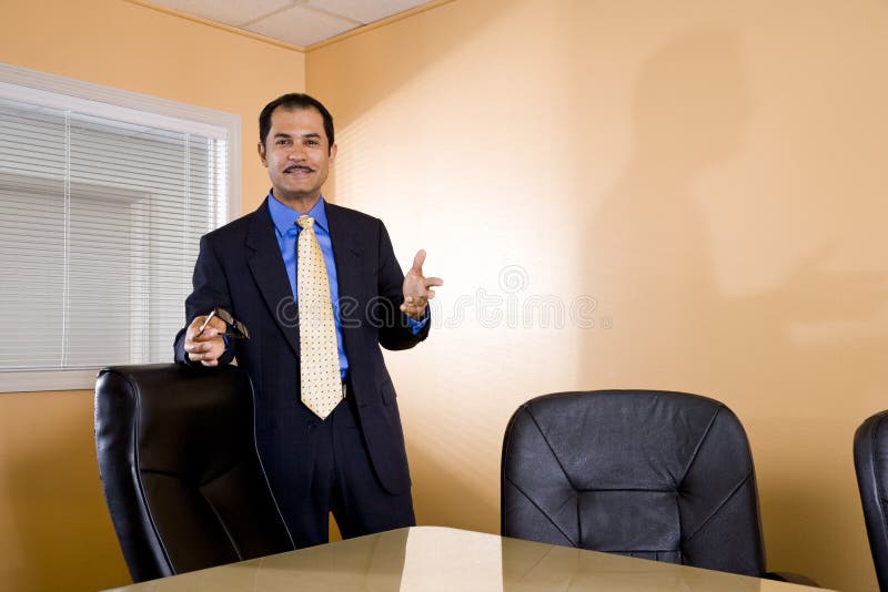 Hispanic Businessman Making a Point Stock Photo - Image of worker ...