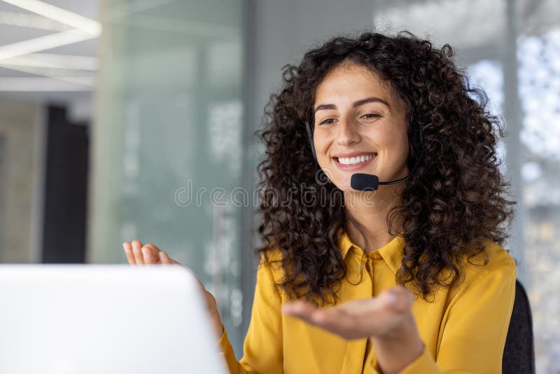 Hispanic Businesswoman with Curly Hair Smiling while Working in Modern ...