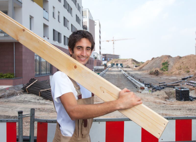 Hispanic Carpenter At Work On Construction Site Stock Photo - Image of ...