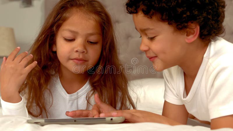 Hispanic Children Playing Together on a Tablet Stock Video - Video of ...