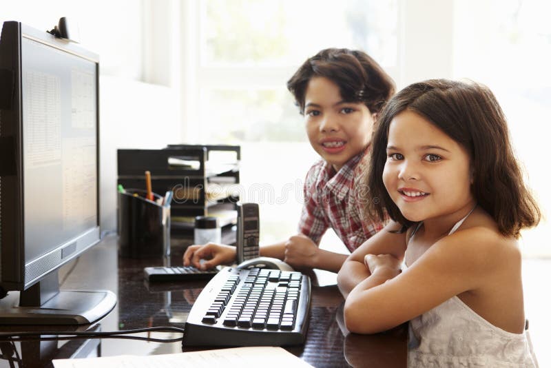 Hispanic Children Using Computer at Home Stock Photo - Image of alone ...