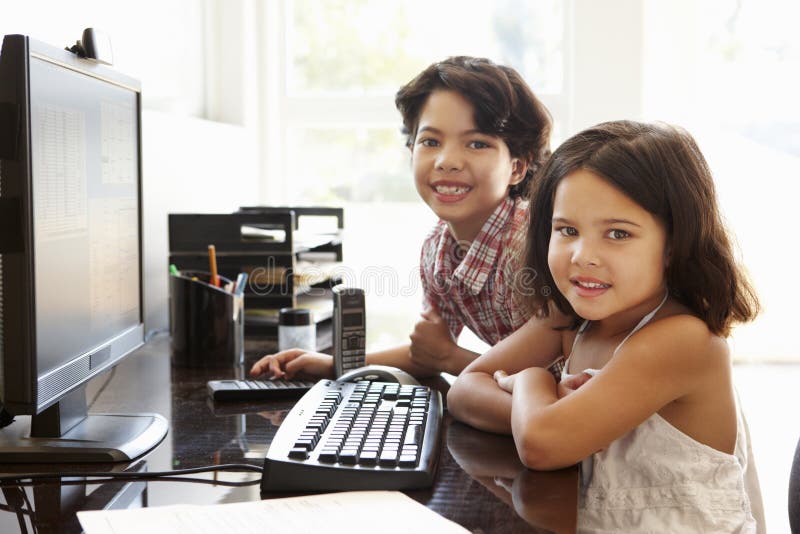 Hispanic Children Using Computer at Home Stock Image - Image of ...