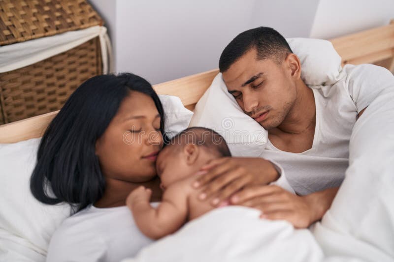 Hispanic Family Lying on Bed Sleeping at Bedroom Stock Image - Image of ...