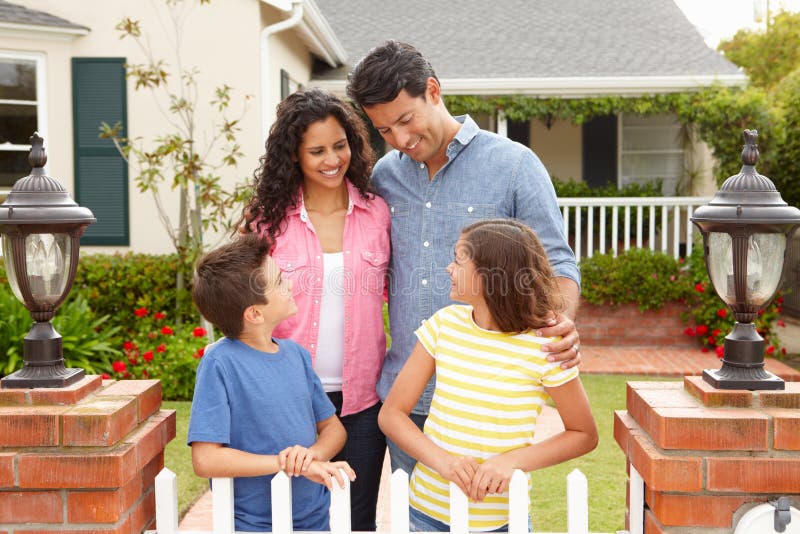 Hispanic Family Standing Outside Home Stock Photo - Image of horizontal ...