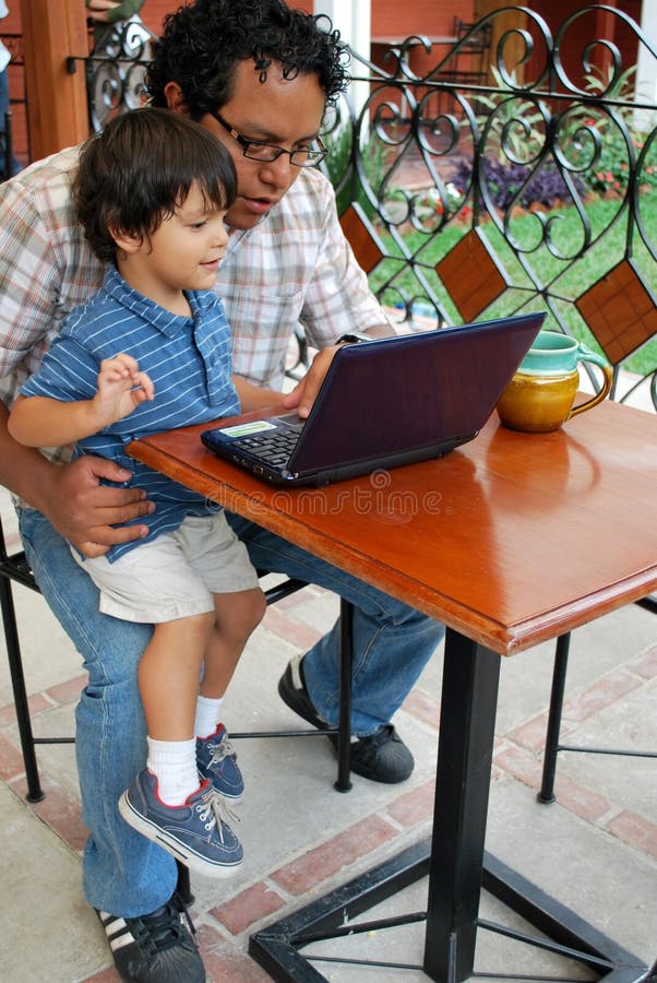 Hispanic Family Using a Computer Stock Image - Image of central ...