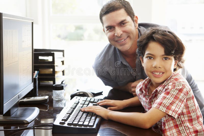 Hispanic Father with Baby Working in Home Office Stock Image - Image of ...