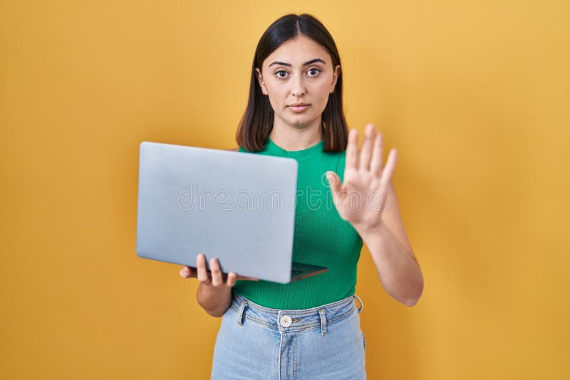 Hispanic Girl Working Using Computer Laptop with Open Hand Doing Stop ...