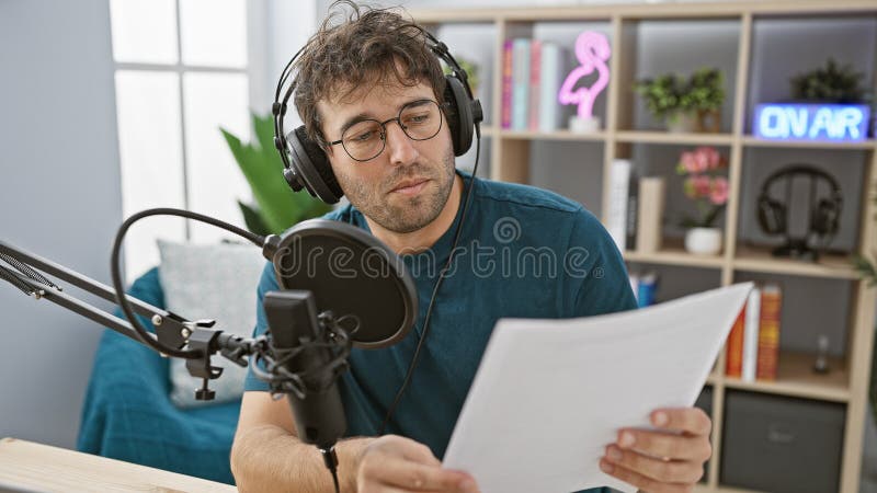 Hispanic Man with Beard and Headphones Reading Script in Radio Studio ...