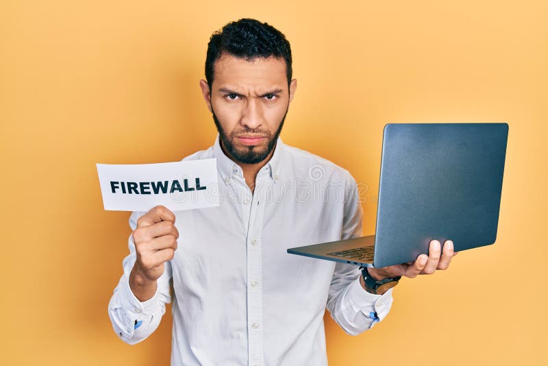 Hispanic Man with Beard Holding Computer Laptop and Firewall Banner ...