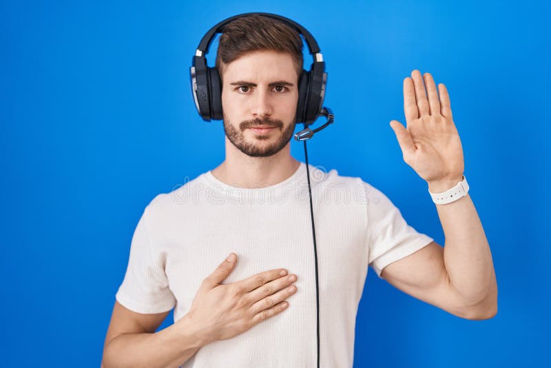 Hispanic Man With Beard Listening To Music Wearing Headphones Swearing