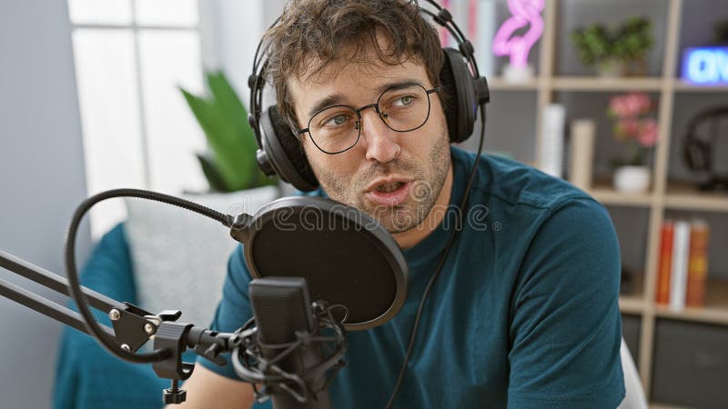 Hispanic Man with Beard Speaking into Microphone in Radio Studio Setup ...