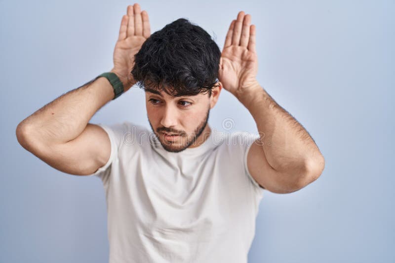 Hispanic Man with Beard Standing Over White Background Doing Bunny Ears ...