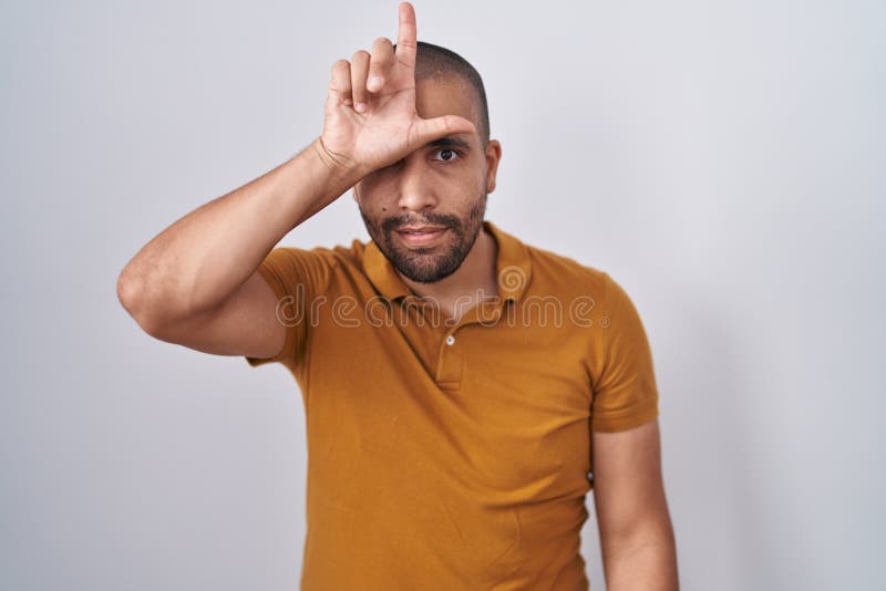 Hispanic Man with Beard Standing Over White Background Making Fun of ...