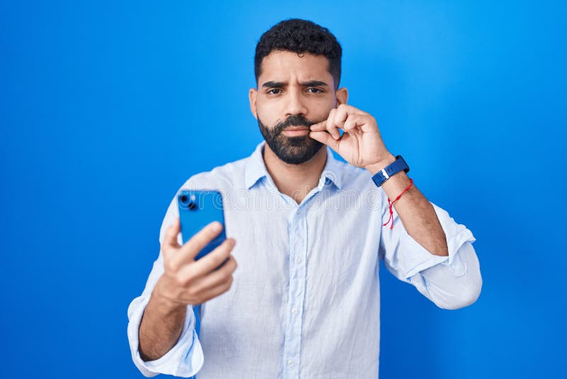 Hispanic Man With Beard Using Smartphone Typing Message Mouth And Lips