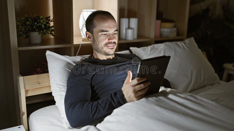 Hispanic Man with Beard Using Tablet in Bedroom at Night Stock Image ...